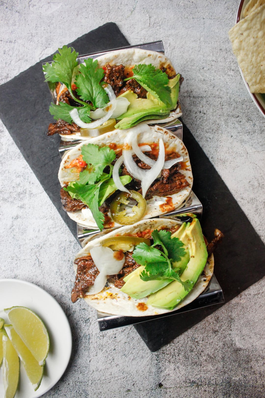 Tacos of marinated ribeye, avocado and some house made pickled onion ...
