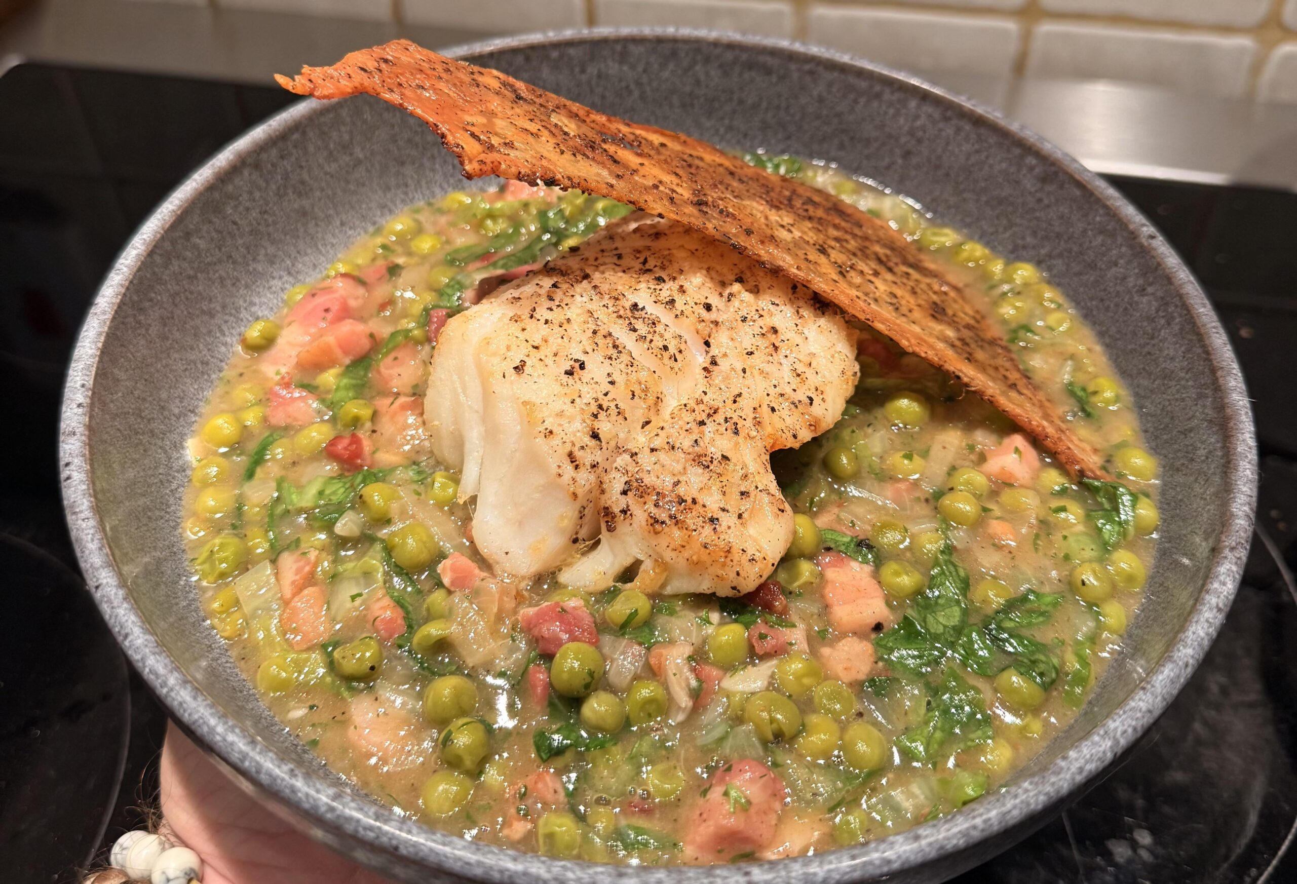 Roasted cod, Petit Pois à la française, Crispy chicken skin - foodiedude